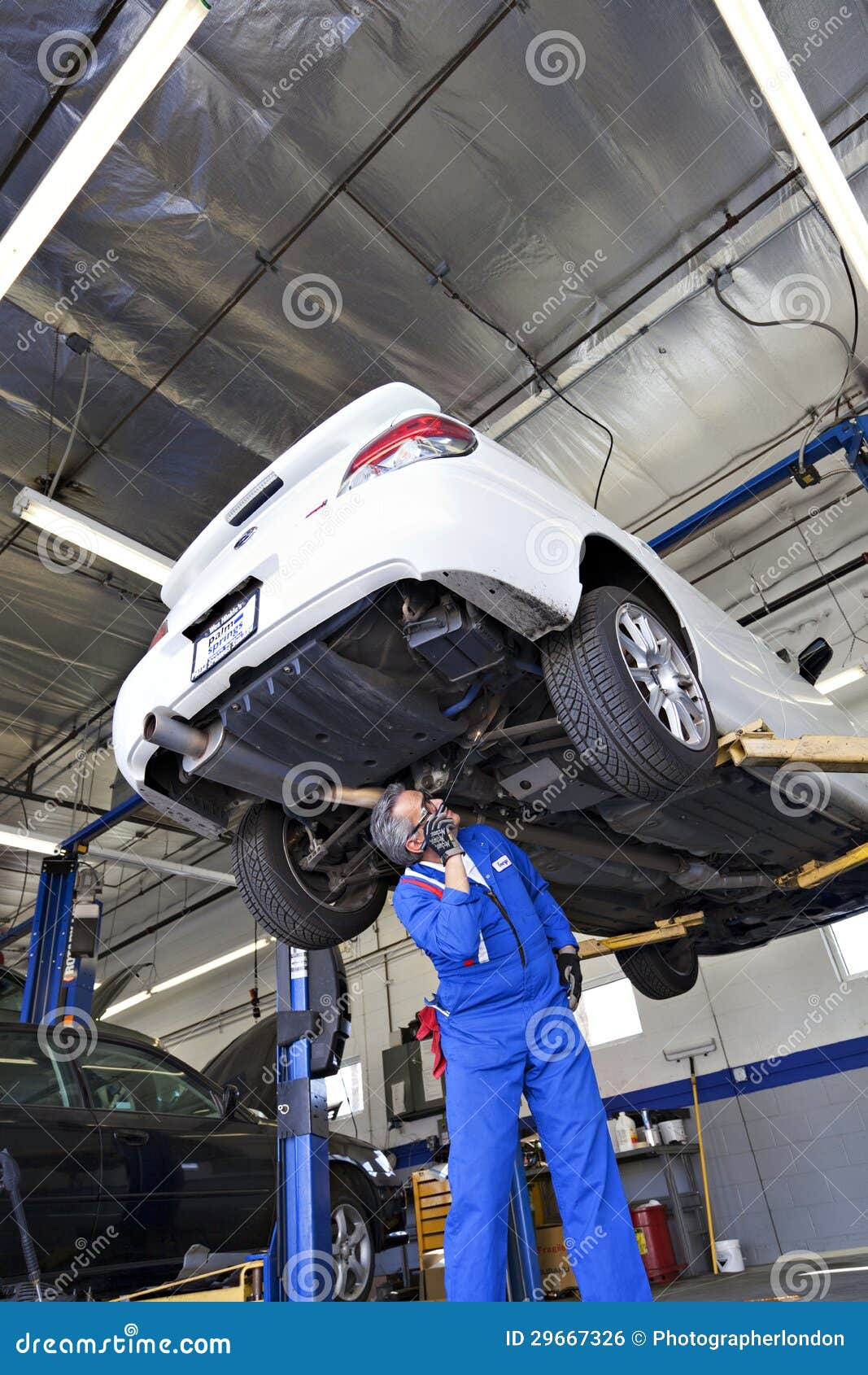 Technician Working on Car at Automobile Repair Shop Stock Photo - Image ...