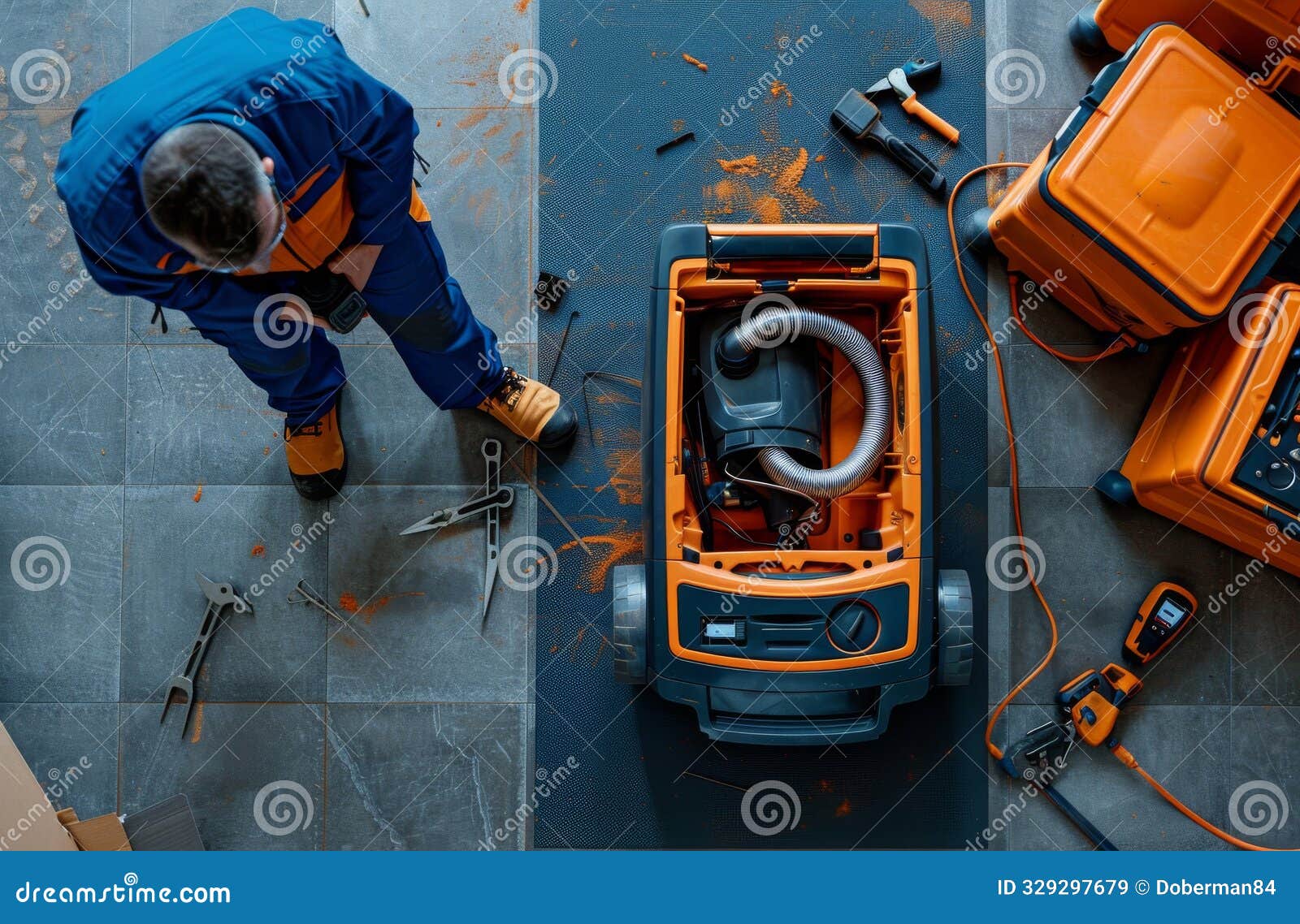 Technician Working with an Electric Vacuum Cleaner in a Cluttered ...