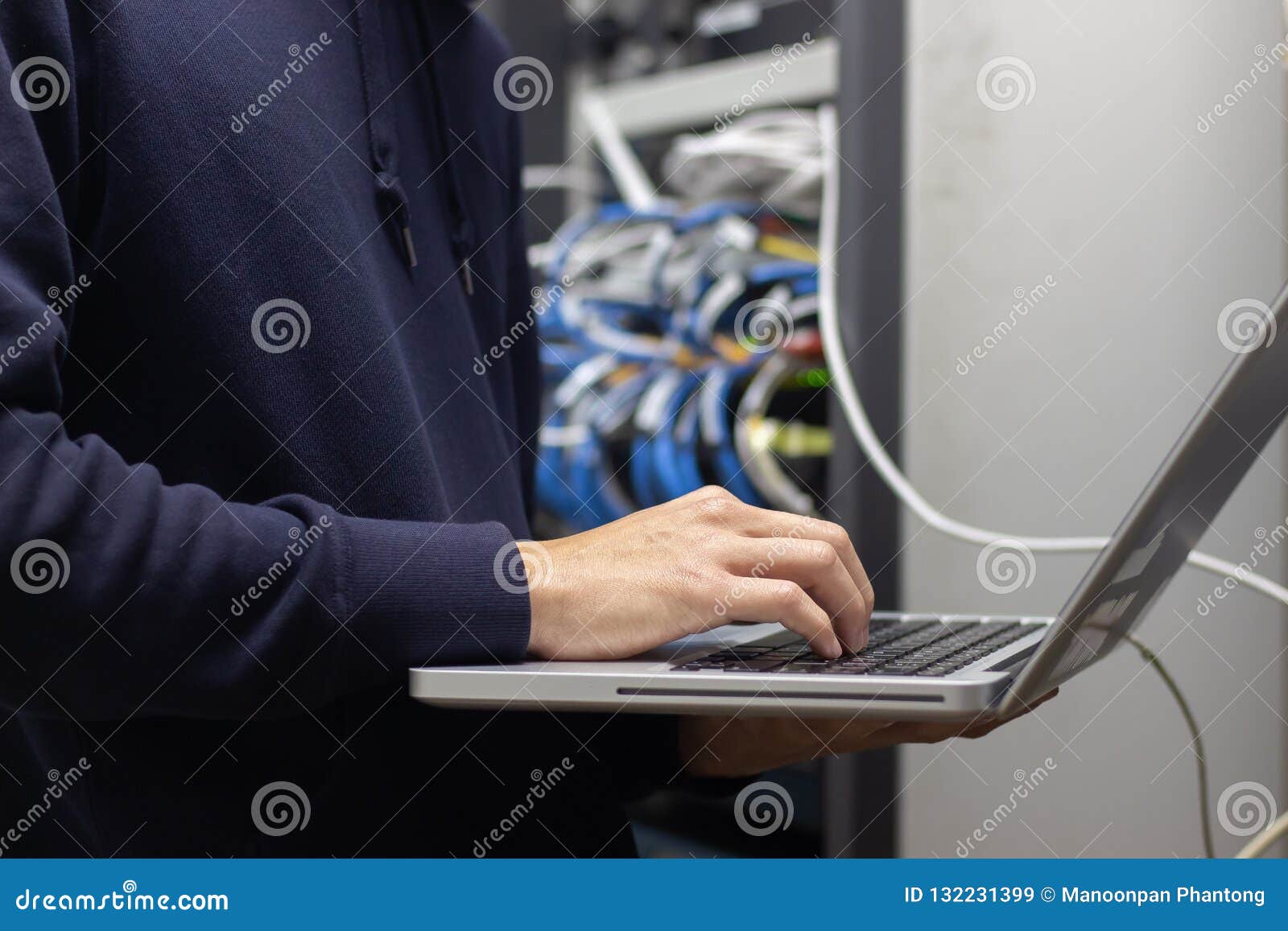 Technician Working on Laptop in Server Room Stock Image - Image of ...