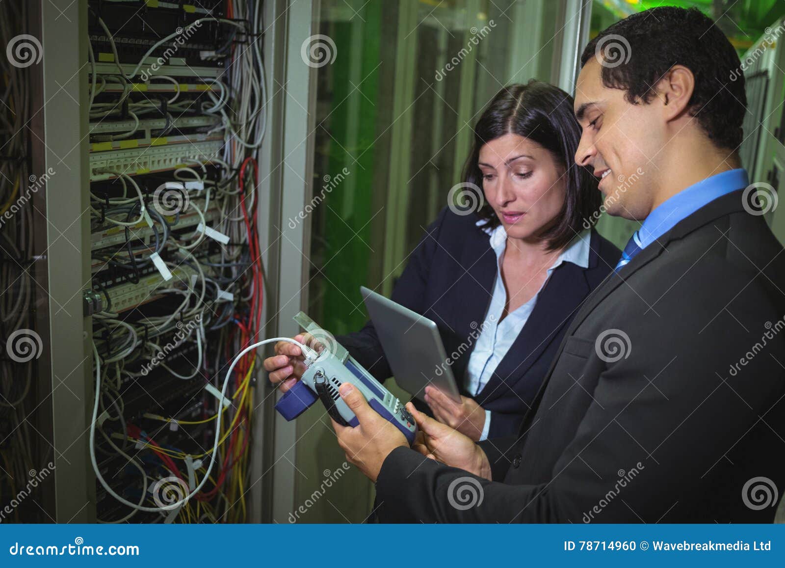 Technician Working on Personal Computer while Analyzing Server ...