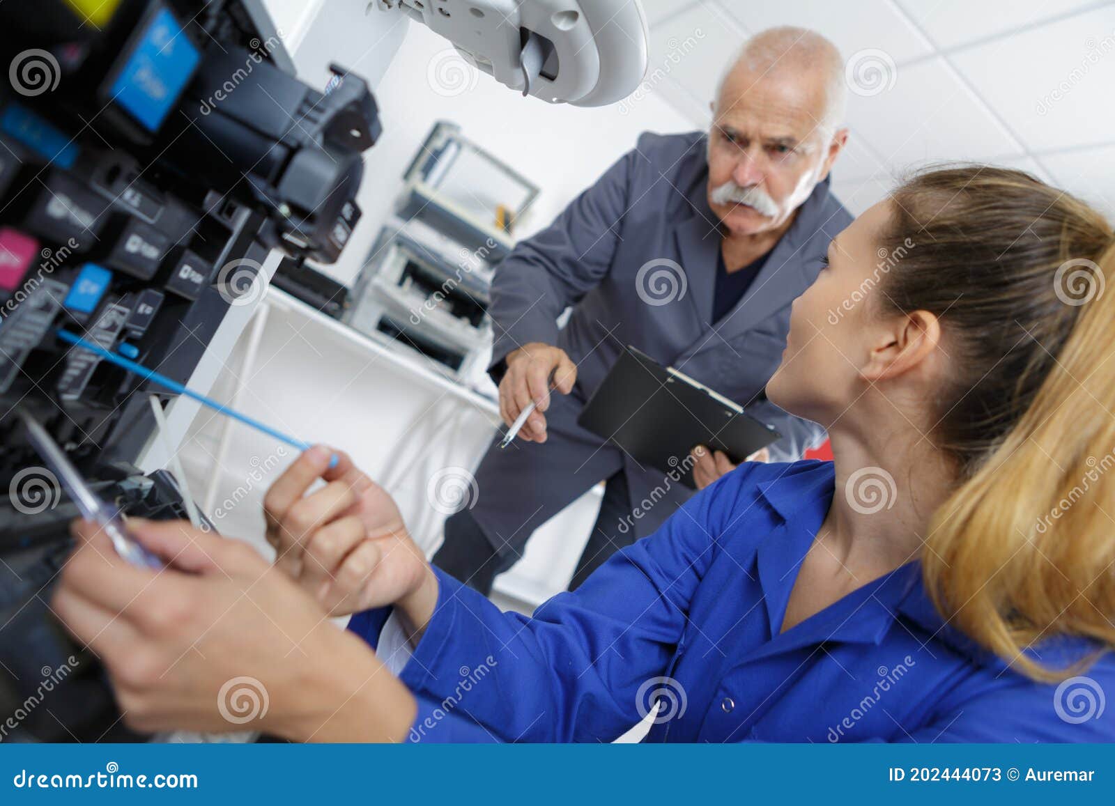 Technician Working on Photocopier Stock Image - Image of female ...