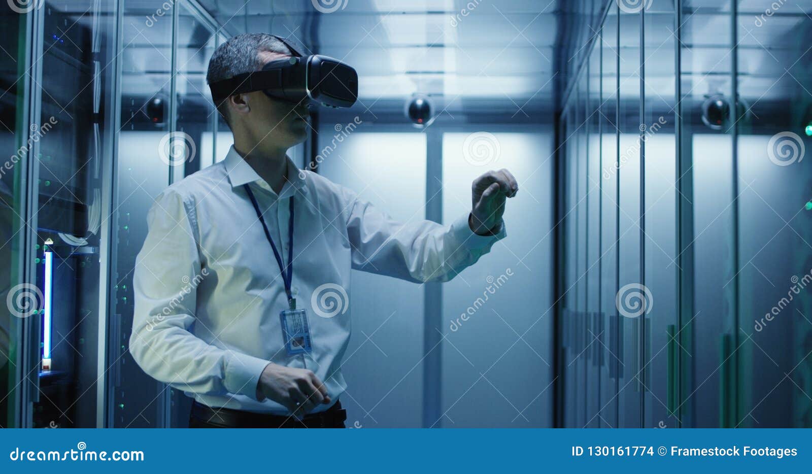 Technician Works in a Data Center Wearing a VR Headset Stock Photo ...