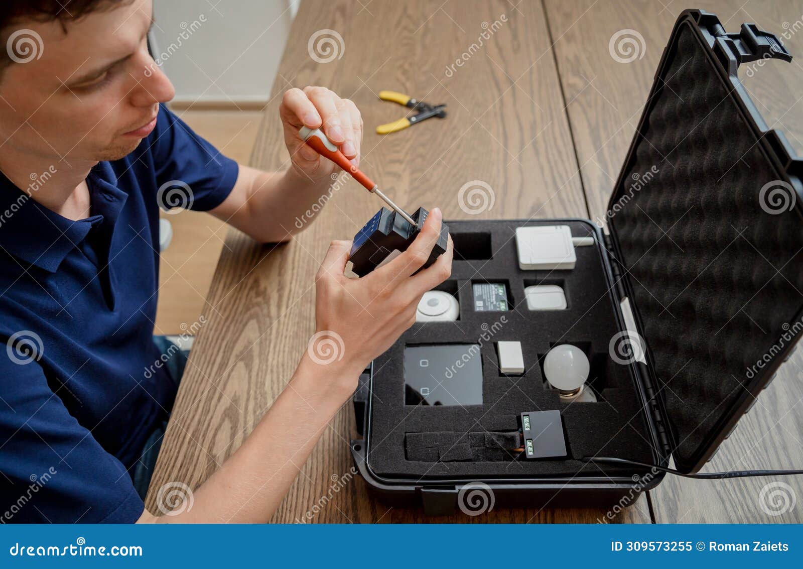 A Technician Works with a Demo Kit of the Smart Home System Stock Image ...