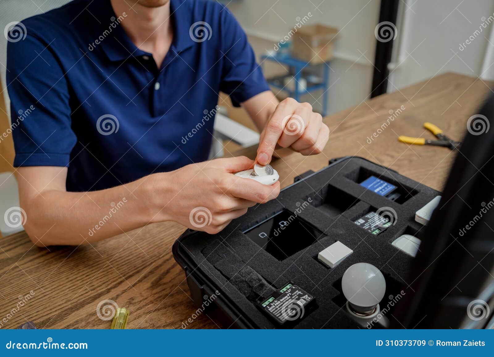 A Technician Works with a Demo Kit of the Smart Home System Stock Image ...