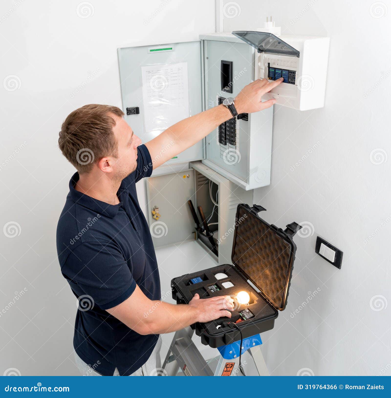 A Technician Works with a Demo Kit of the Smart Home System Stock Photo ...