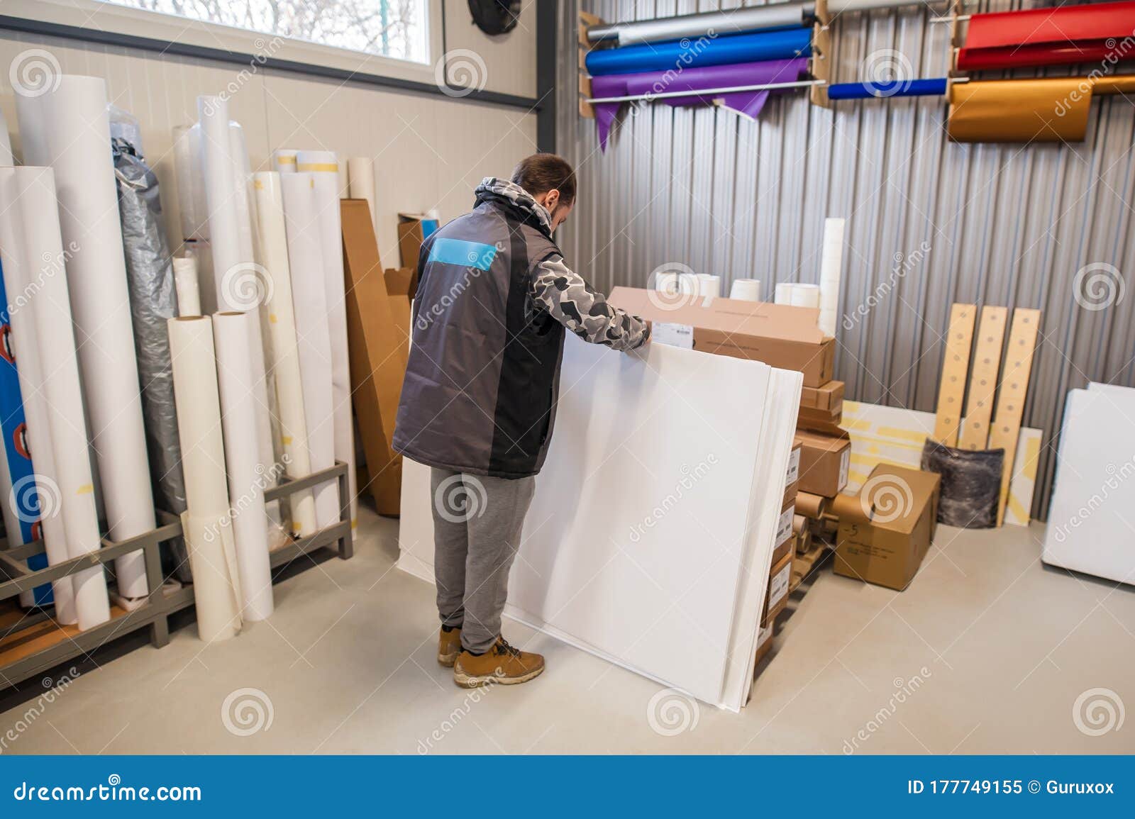 Technician Works in Large Printing Press Hall and Printshop Office ...
