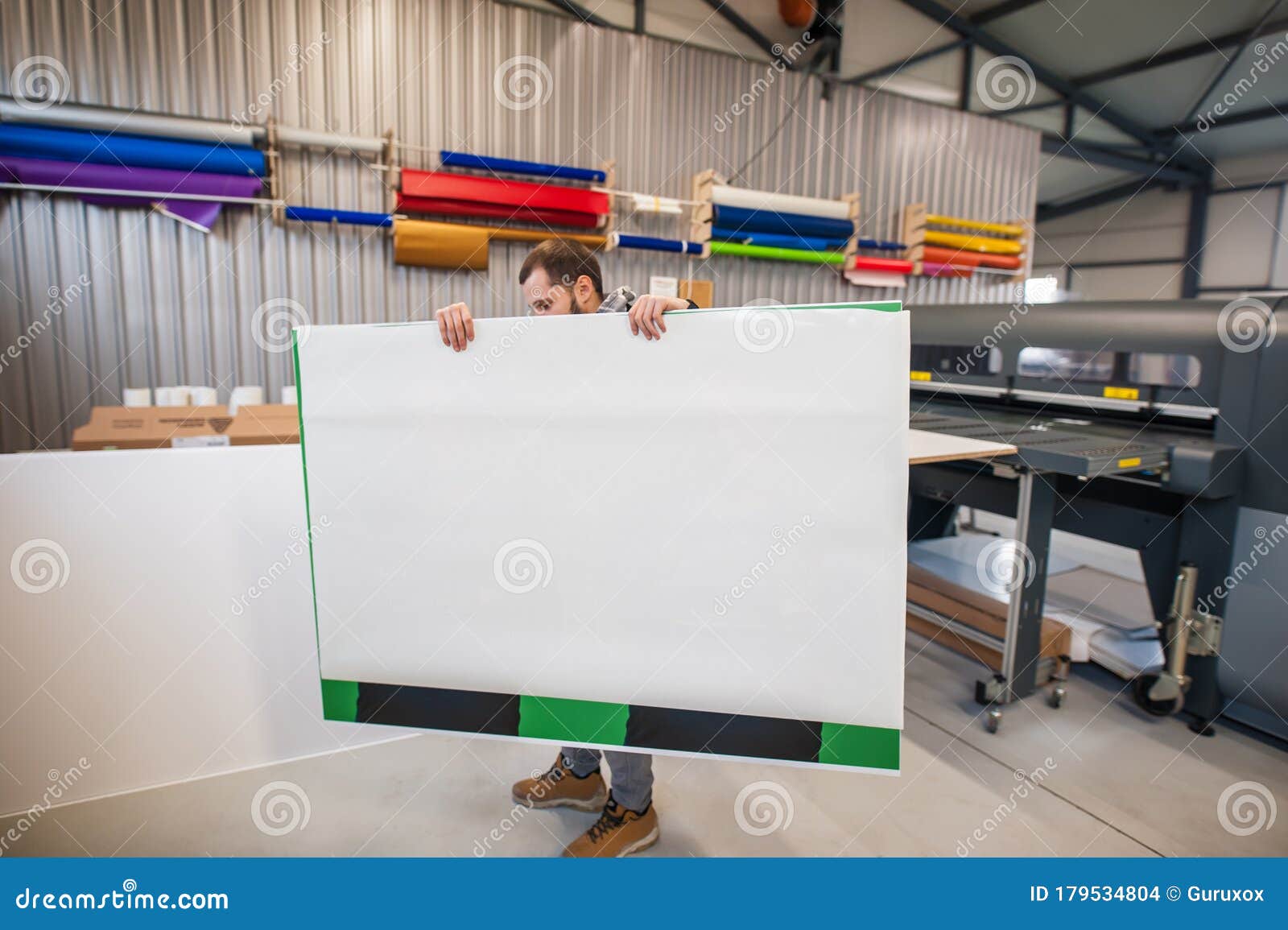 Technician Works in Large Printing Press Hall and Printshop Office ...