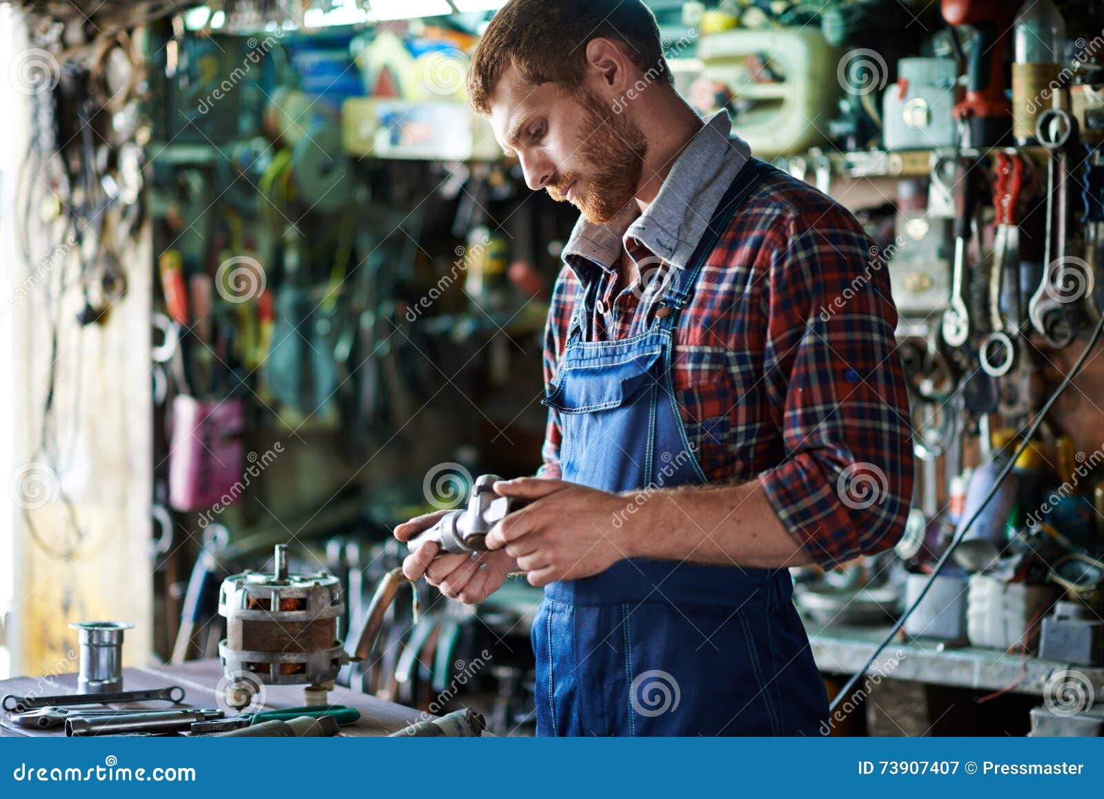 Technician in workshop stock image. Image of engineer - 73907407