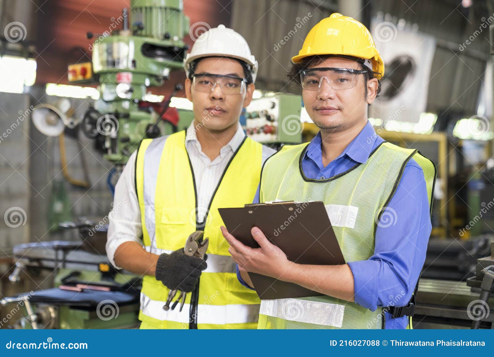 A Technician with a Wrench, Locking Pliers and a File. Factory Workers ...