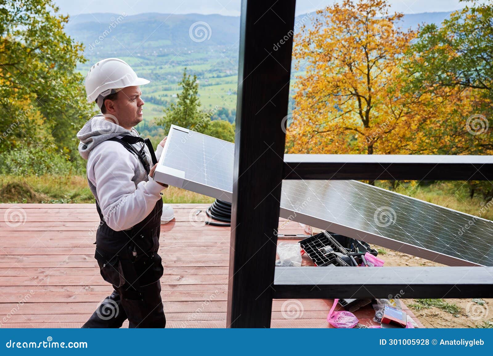 Technicians Carrying Photovoltaic Solar Module while Installing Solar ...