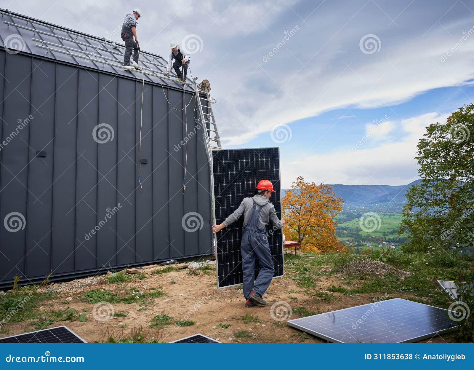 Technicians Carrying Photovoltaic Solar Module while Installing Solar Panel System on Roof of ...