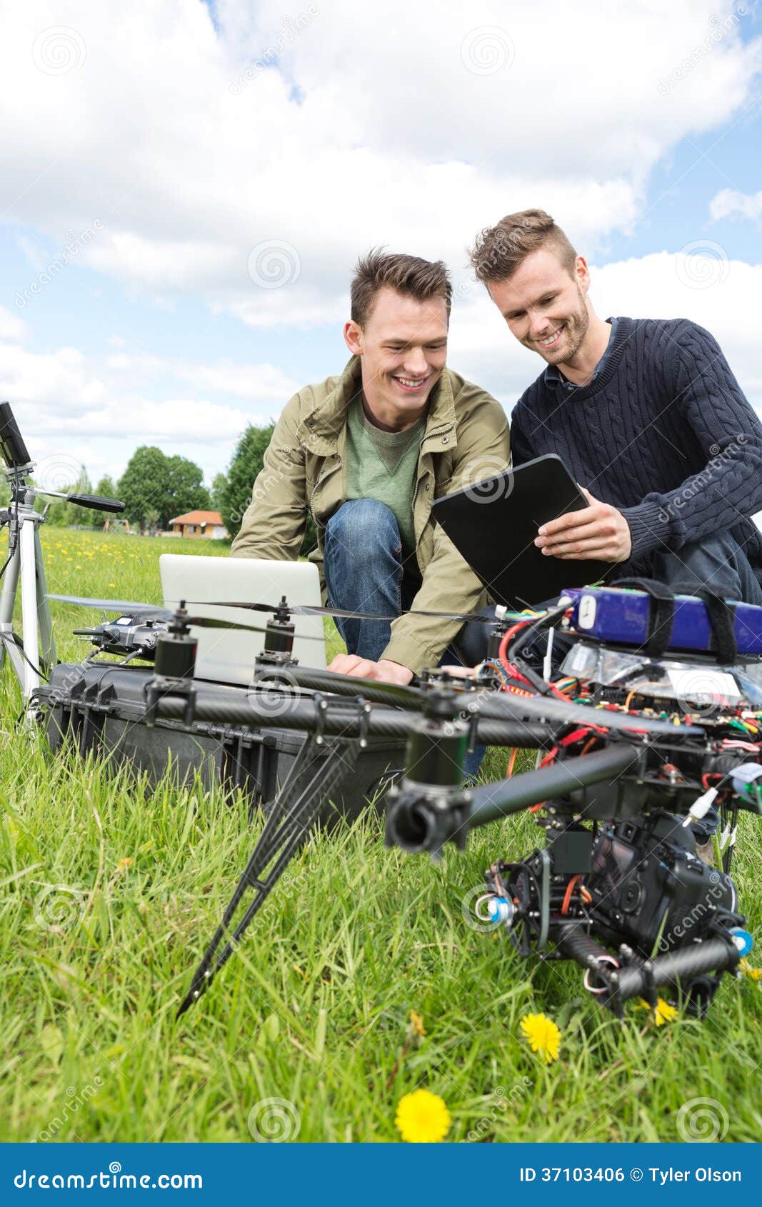 Technicians Discussing Over Digital Tablet by UAV Stock Photo - Image ...