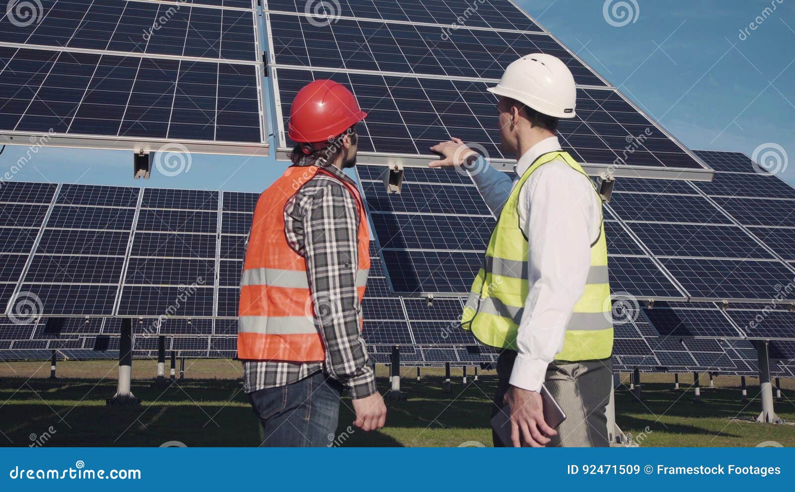 Technicians Discussing Solar Panel Array Outside Stock Image - Image of ...