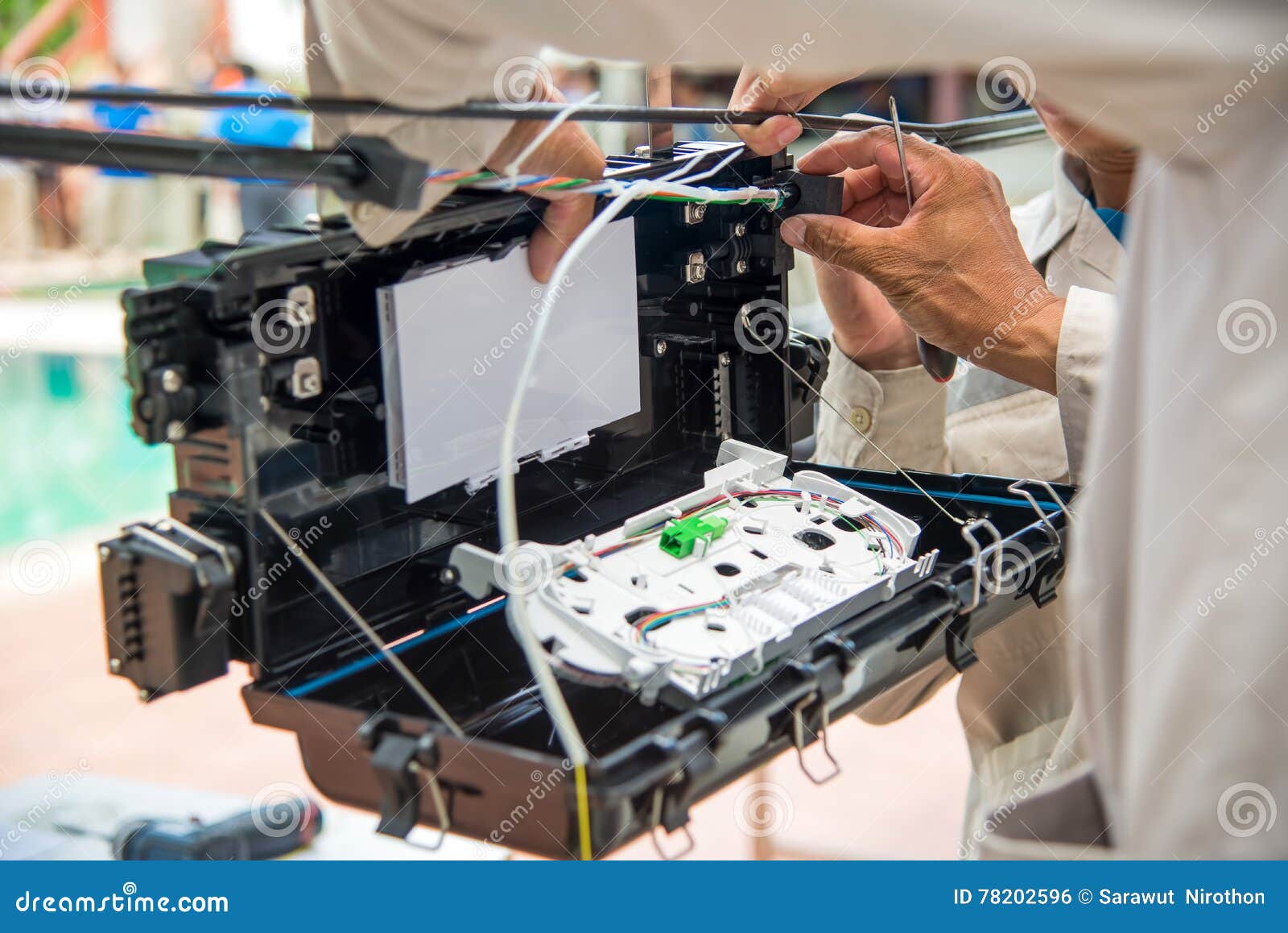 Technicians Install Cabinet on Fiber Optic Cable. Stock Photo - Image ...