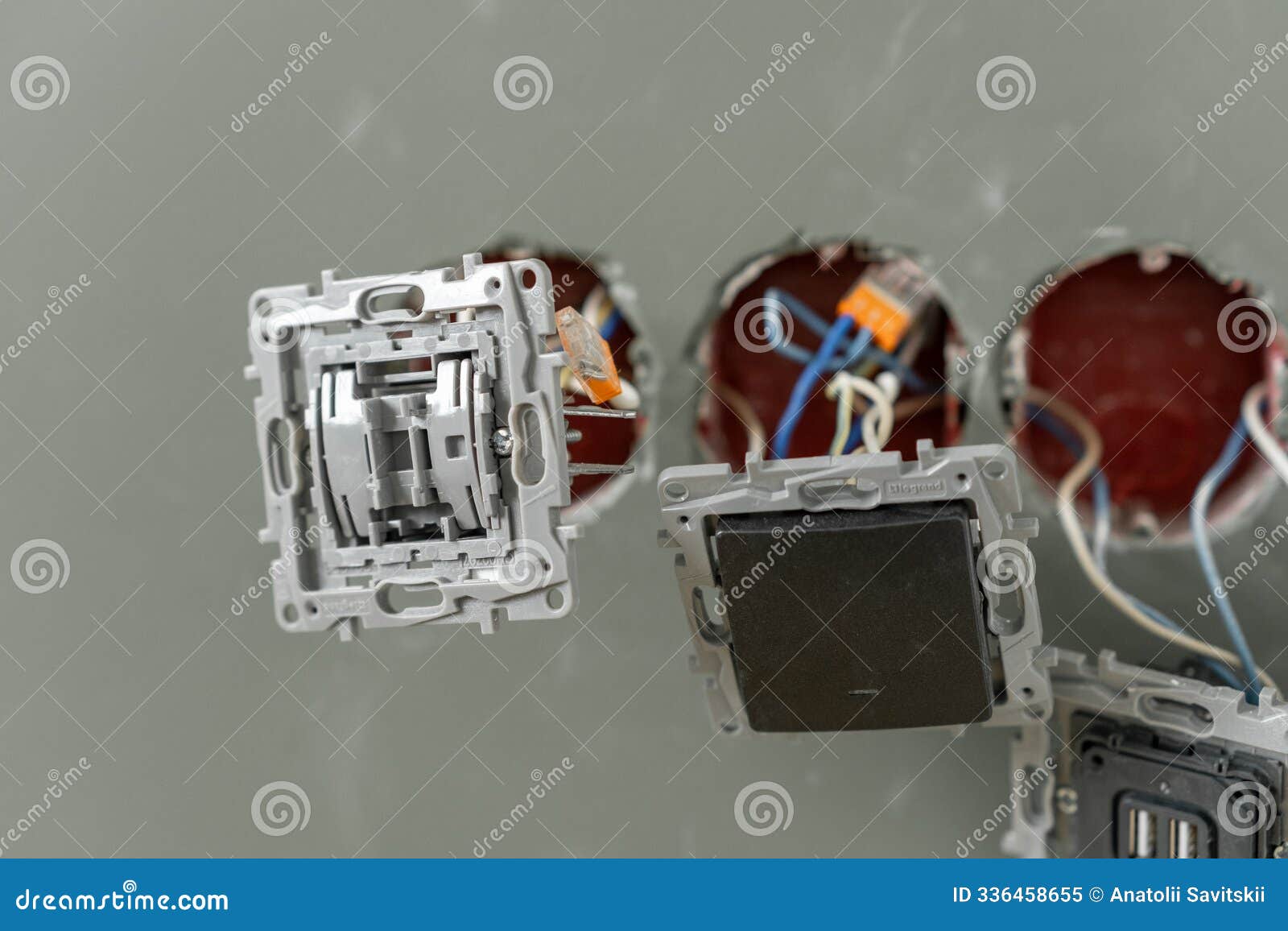 Technicians are Seen Installing Electrical Switch Plates in Wall ...