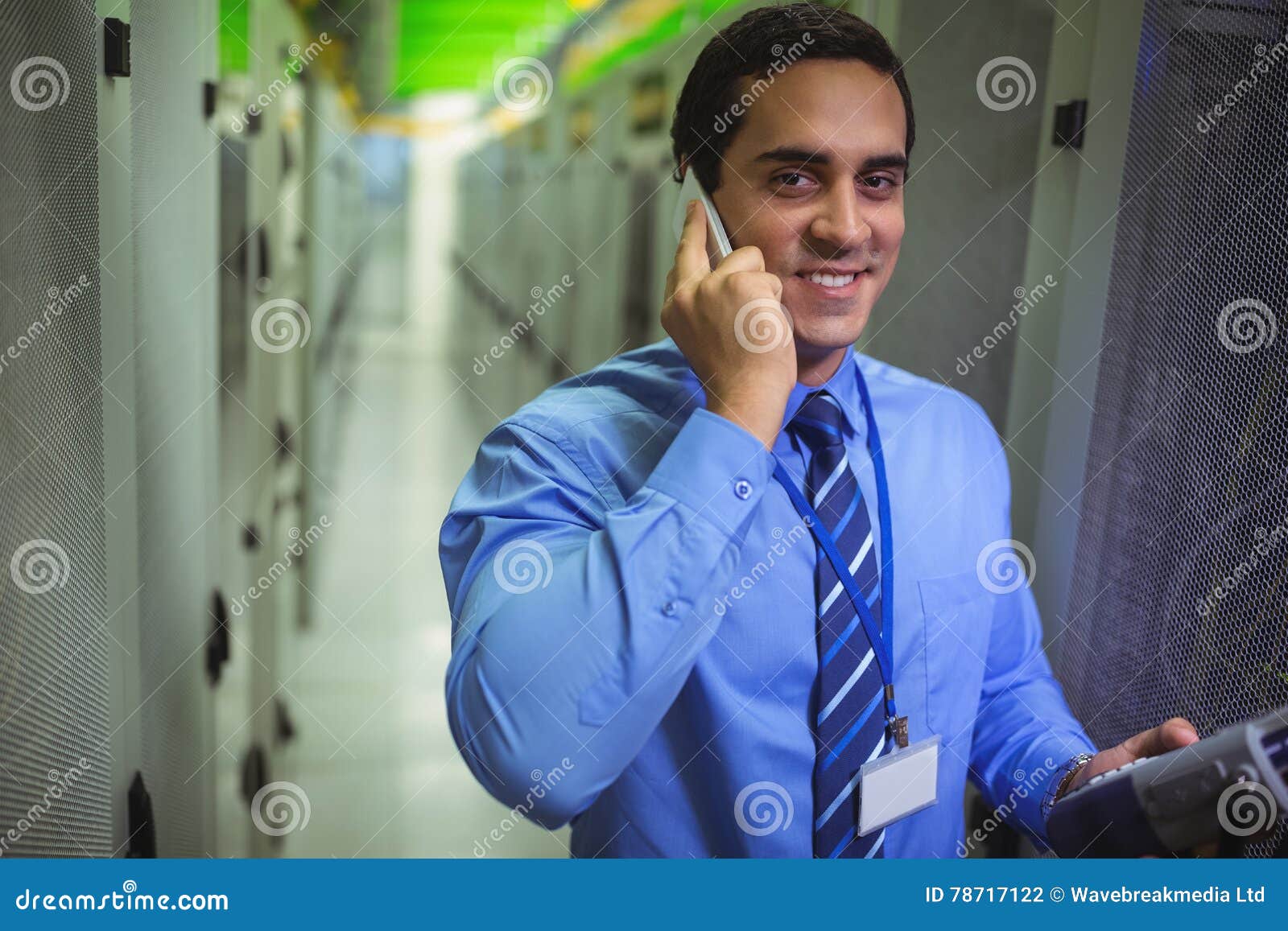 Technicians Talking on Mobile Phone while Analyzing Server Stock Photo ...