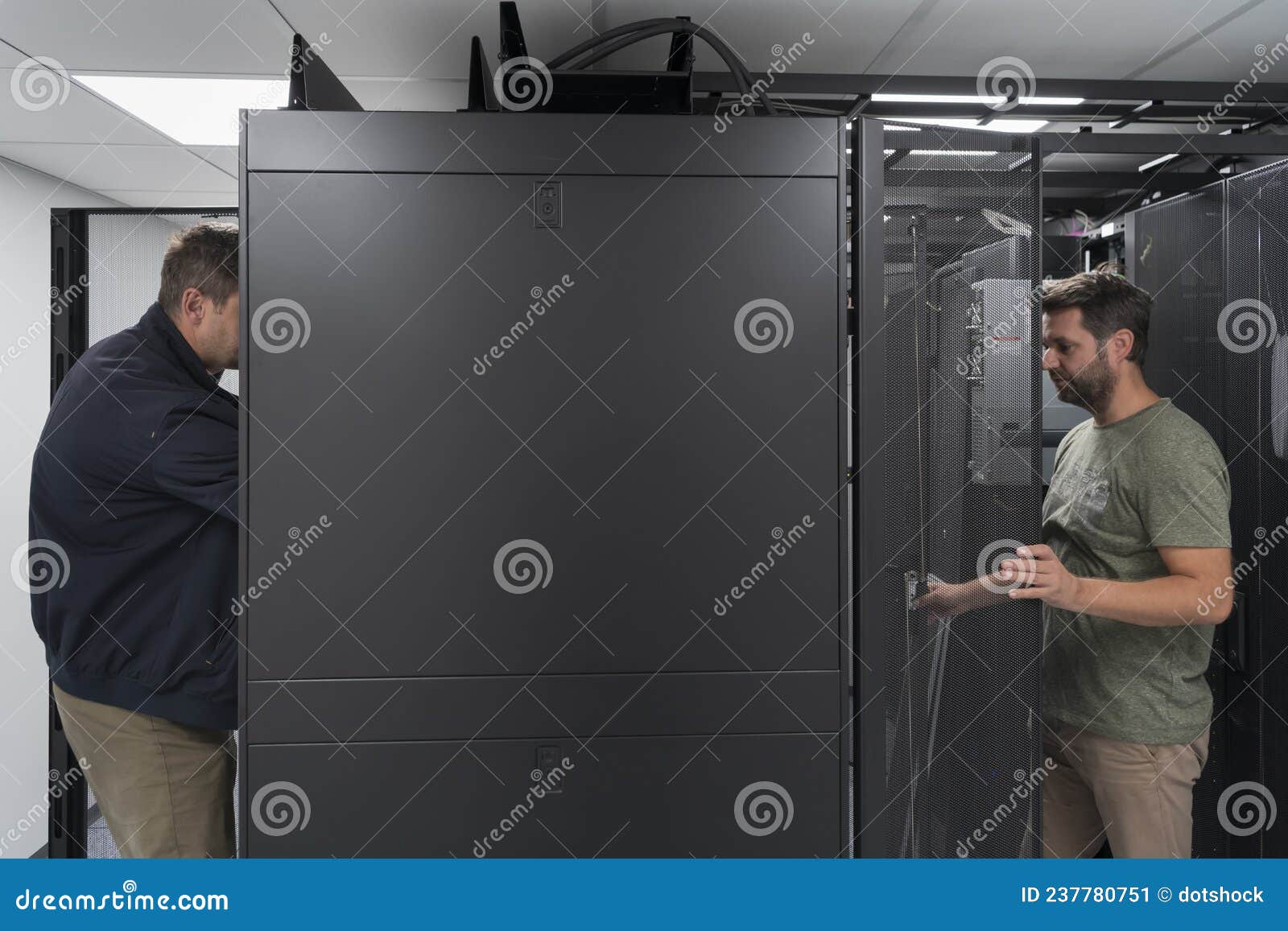 Technicians Team Updating Hardware Inspecting System Performance in ...