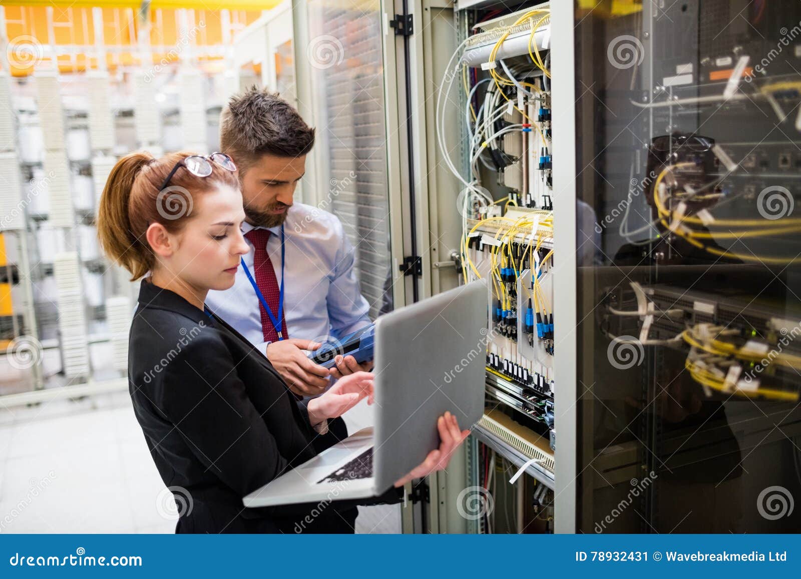 Technicians Using Laptop while Analyzing Server Stock Image - Image of ...
