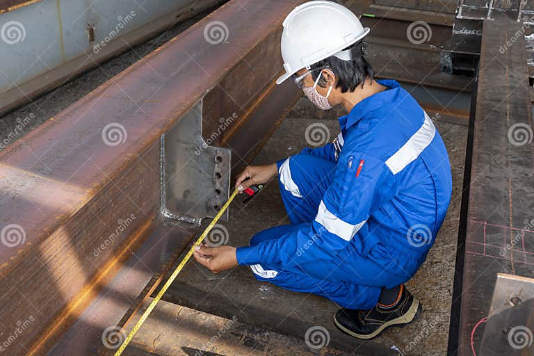 Technicians are Using Measuring Tape To Checking the Accuracy of the ...