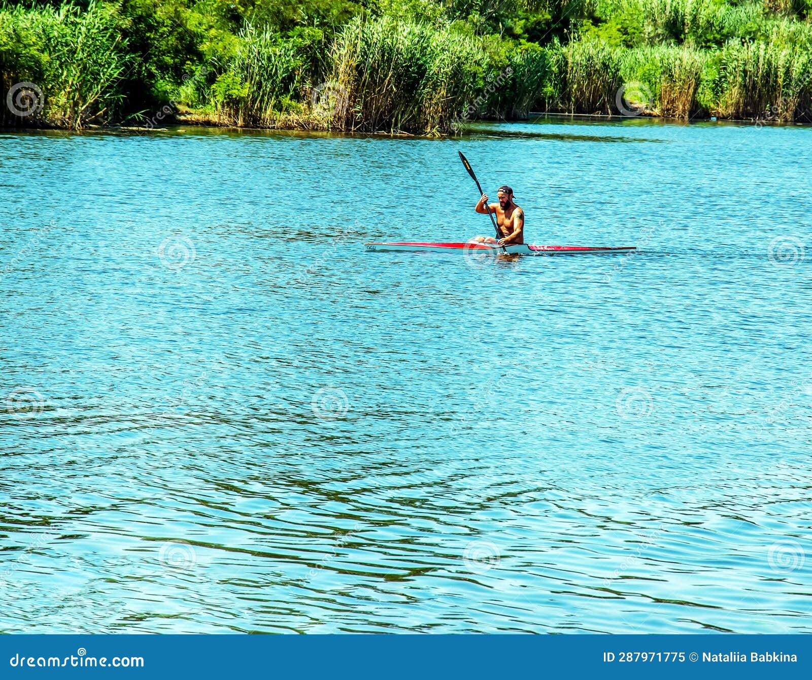 Technique of Rowing of a Single Athlete on a Kayak. Paddle Splash ...
