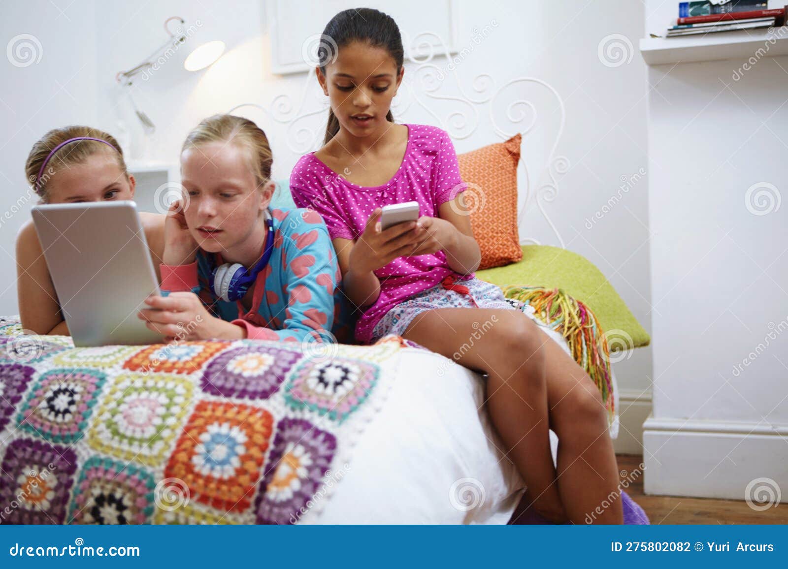 Technological Teens. a Group of Teenage Friends Using a Digital Tablet ...