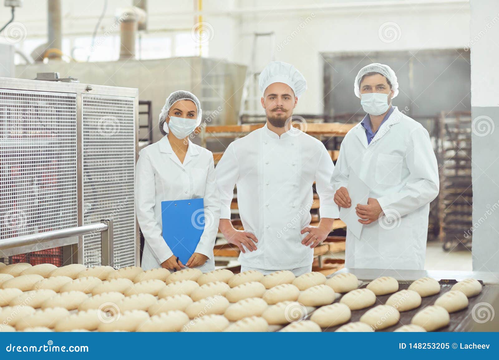 Technologist and Baker Inspect the Bread Production Line at the Bakery ...