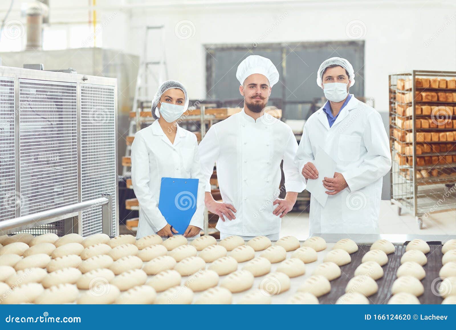 Technologist and Baker Inspect the Bread Production Line at the Bakery ...