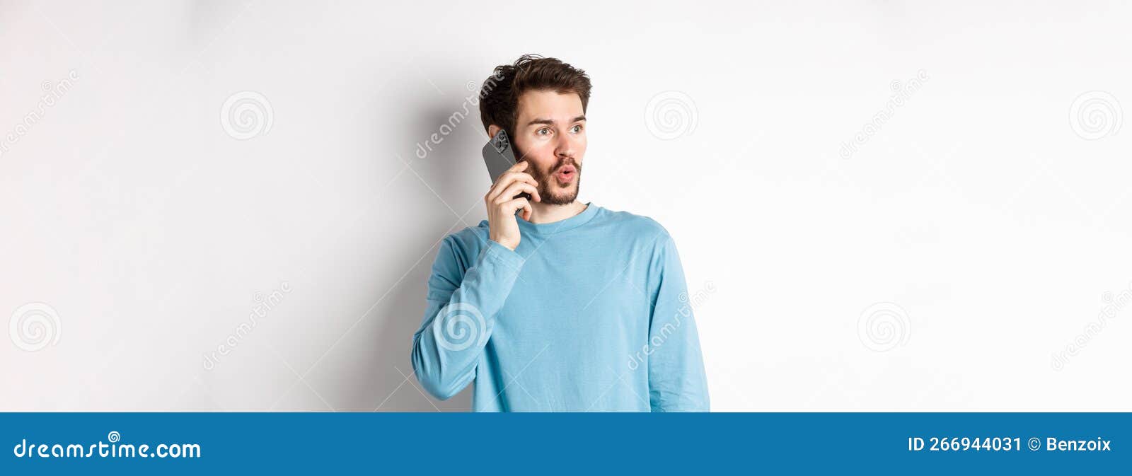 Technology Concept. Intrigued Young Man Looking Left Impressed, Talking ...