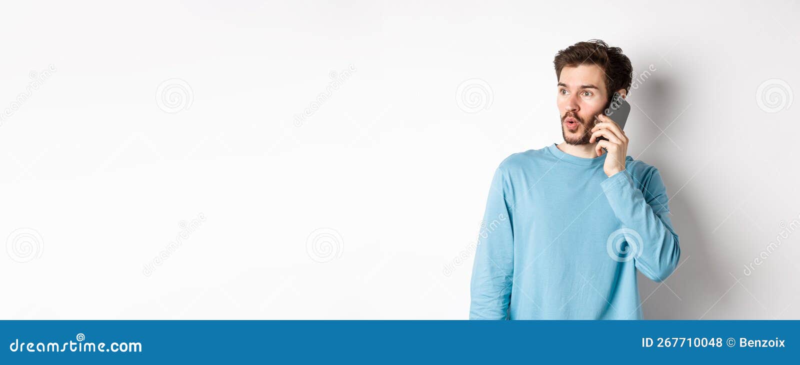 Technology Concept. Intrigued Young Man Looking Left Impressed, Talking ...