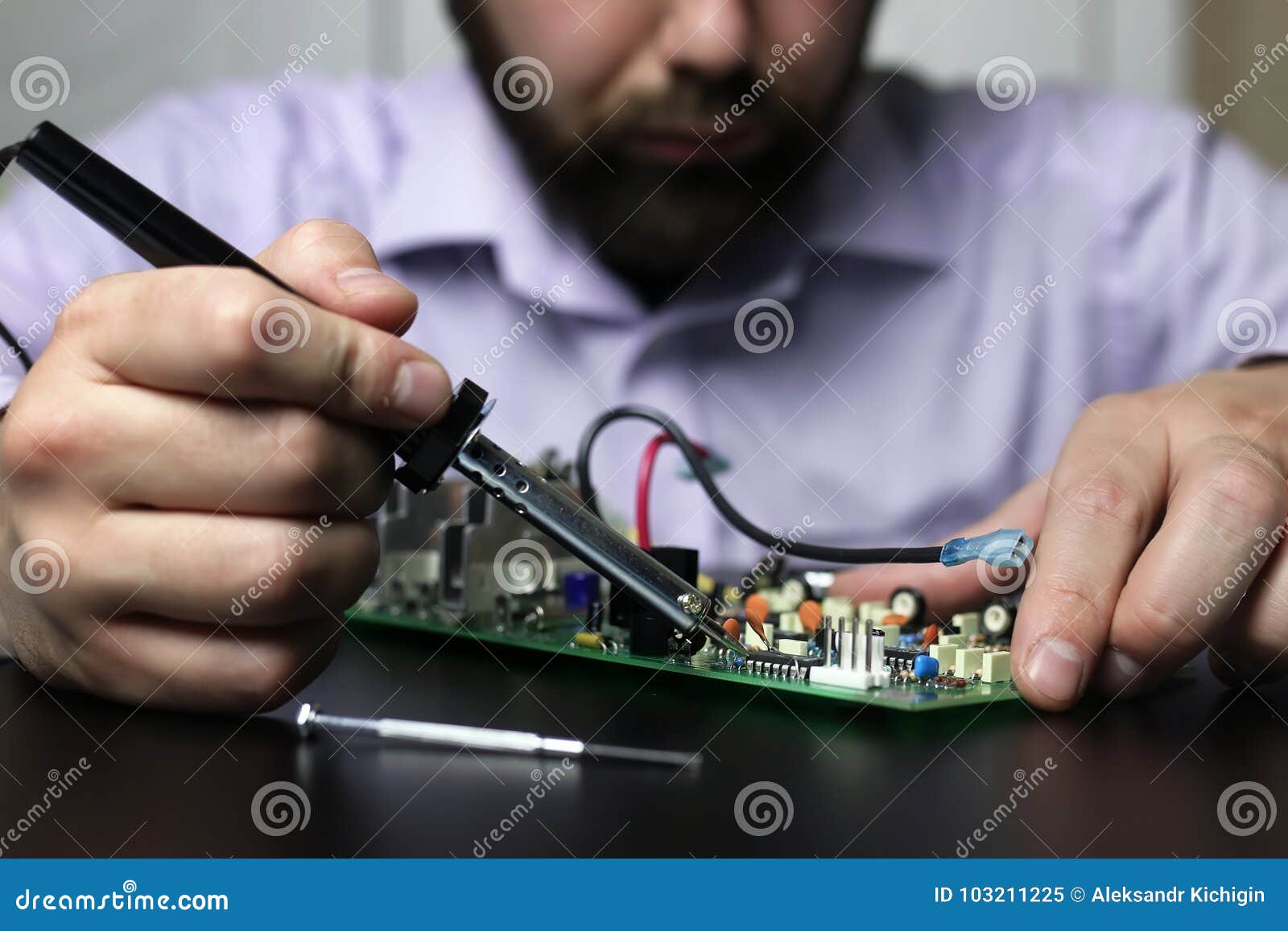 Chip soldering man hands stock image. Image of person - 103211225