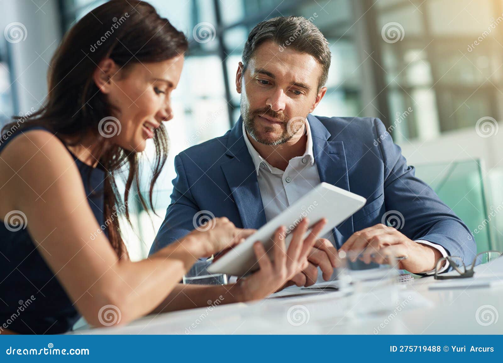 Technology Enhances Business Interactions. Two Businesspeople Using a ...