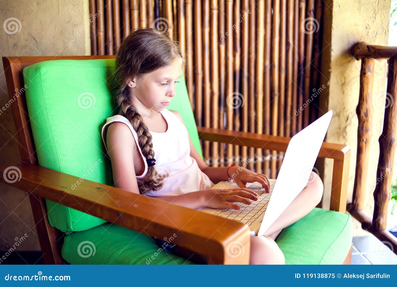 Technology, Gaming and People Concept - Girl Using Laptop Computer at ...