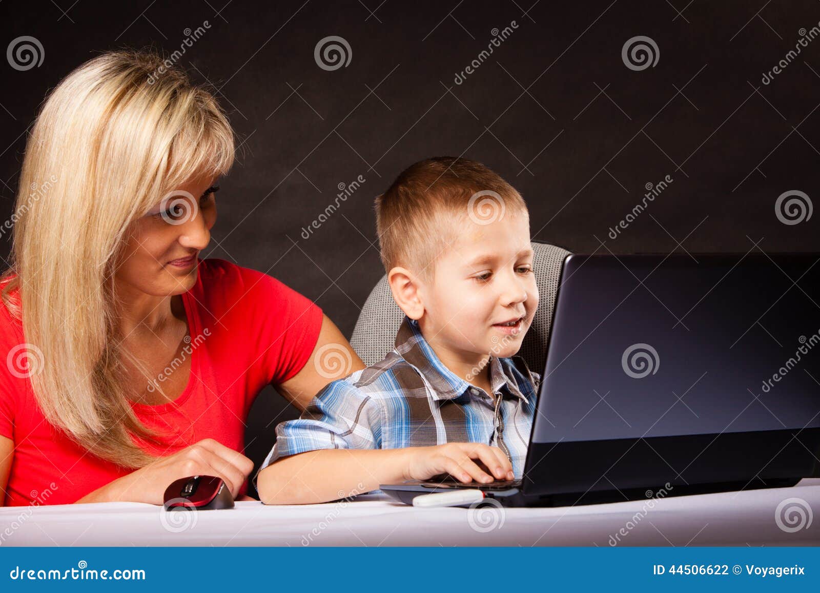 Technology and Parenting - Boy and Mother with Laptop Stock Photo ...