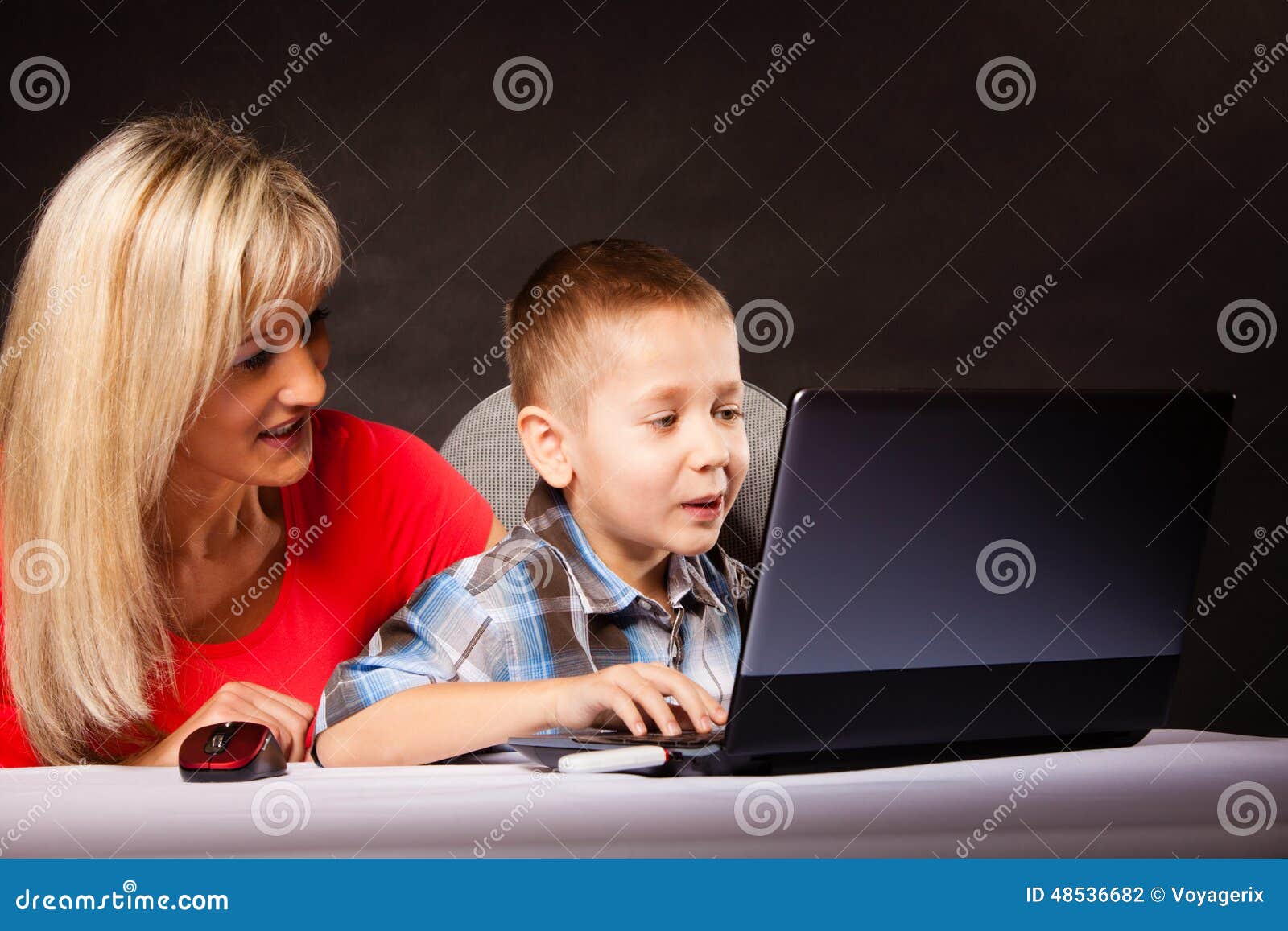 Technology and Parenting - Boy and Mother with Laptop Stock Photo ...