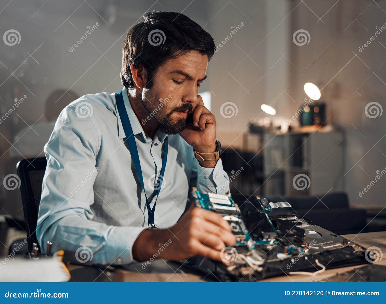 Technology, Repair and Thinking with an Man Fixing a Device in an ...