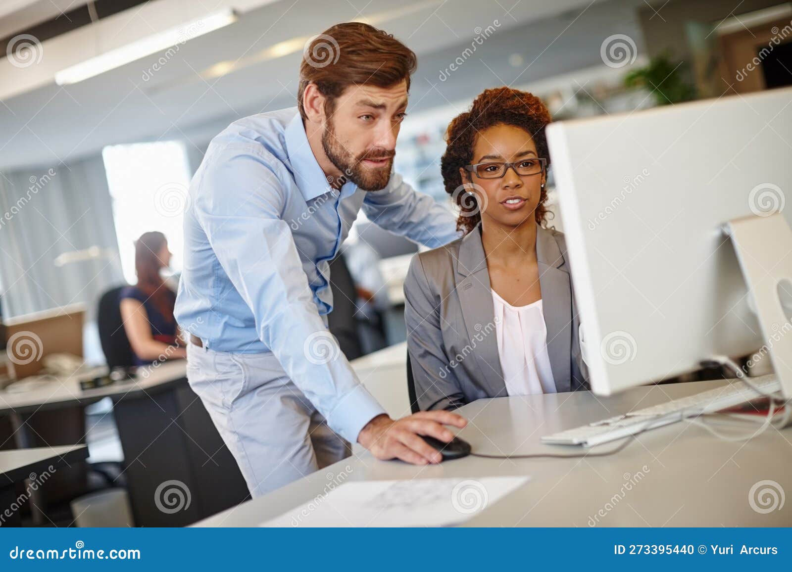 Technology and Teamwork - the Right Tools for Success. Two Coworkers ...