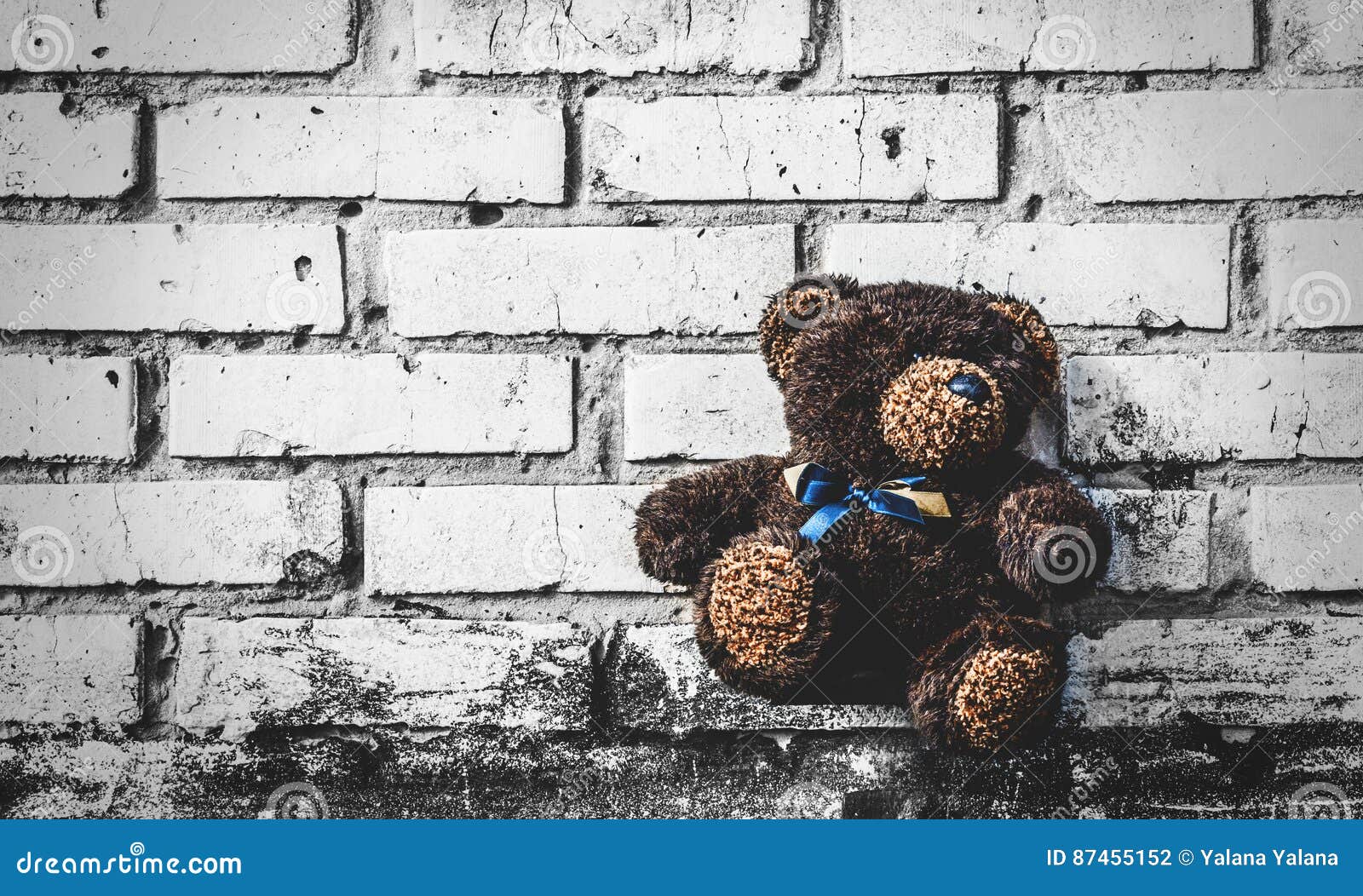 Teddy Bear on a Background of Gray Brick Wall Stock Photo - Image of ...