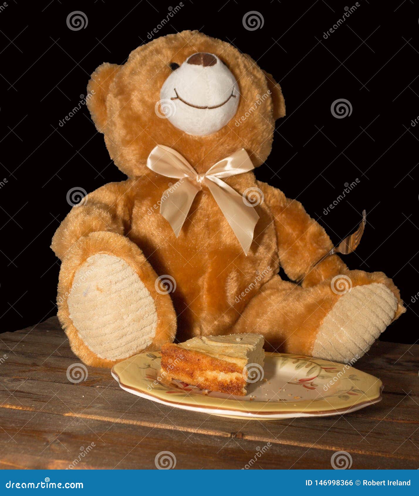 Teddy Bear eating cake Low stock photo. Image of outside - 146998366