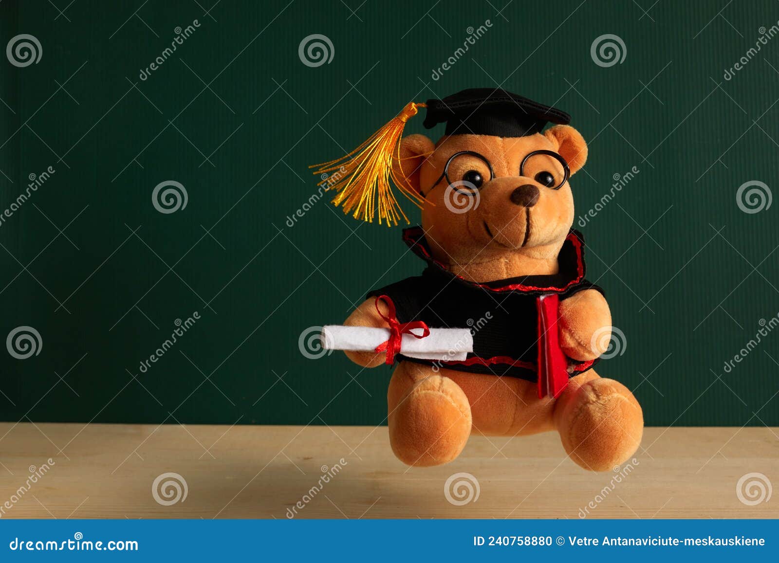 Teddy Bear with Graduation Hat and Diploma in Front of Green Chalkboard ...