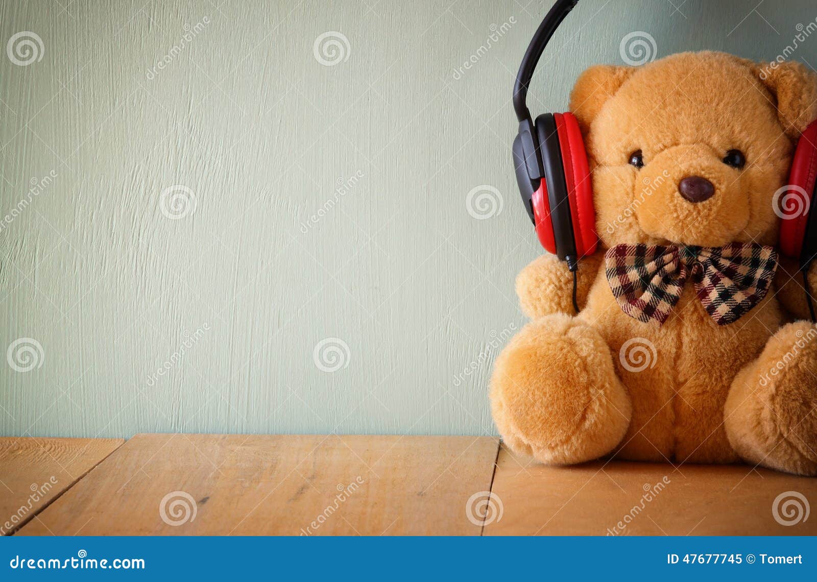 Teddy Bear with Headphones Over Wooden Table Stock Image - Image of ...