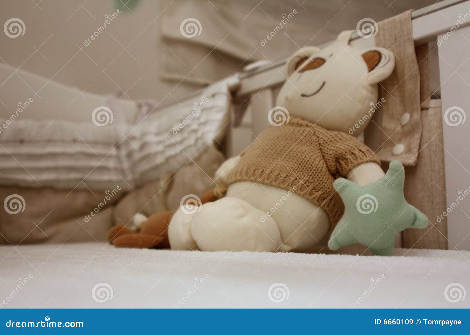 Teddy Bear inside Cot stock image. Image of bumper, soft - 6660109