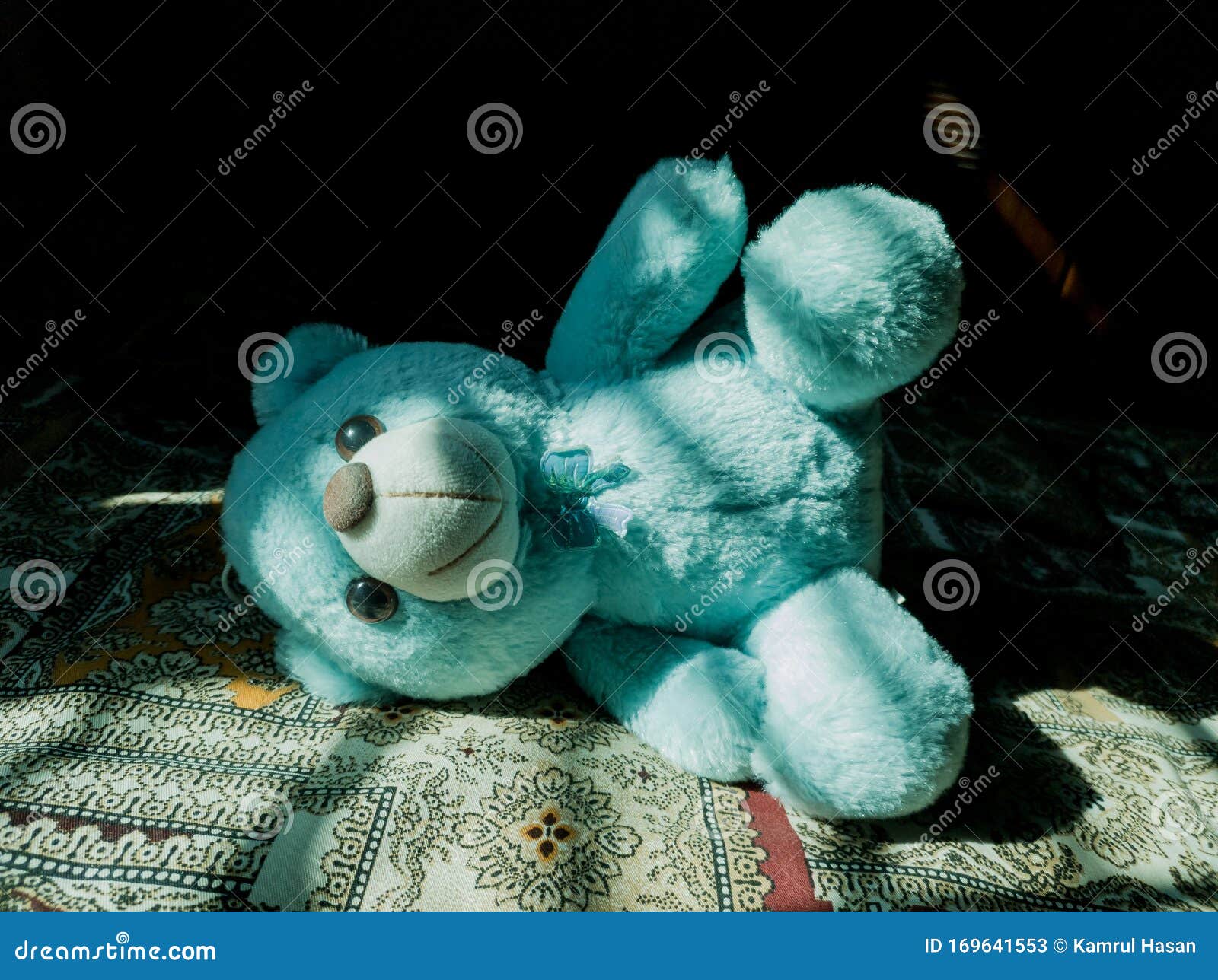 A Teddy Bear Lying on Bed and Busk in the Sun Stock Image - Image of ...