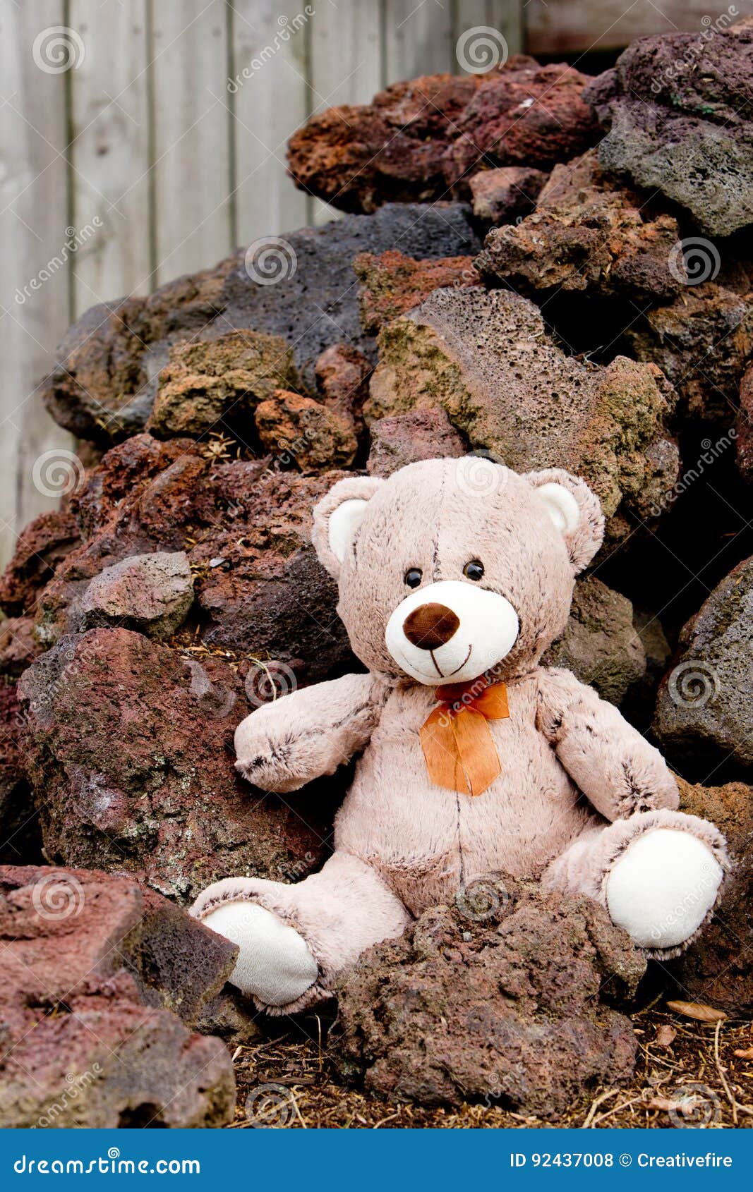 Teddy Bear on rock pile stock photo. Image of stack, rustic - 92437008