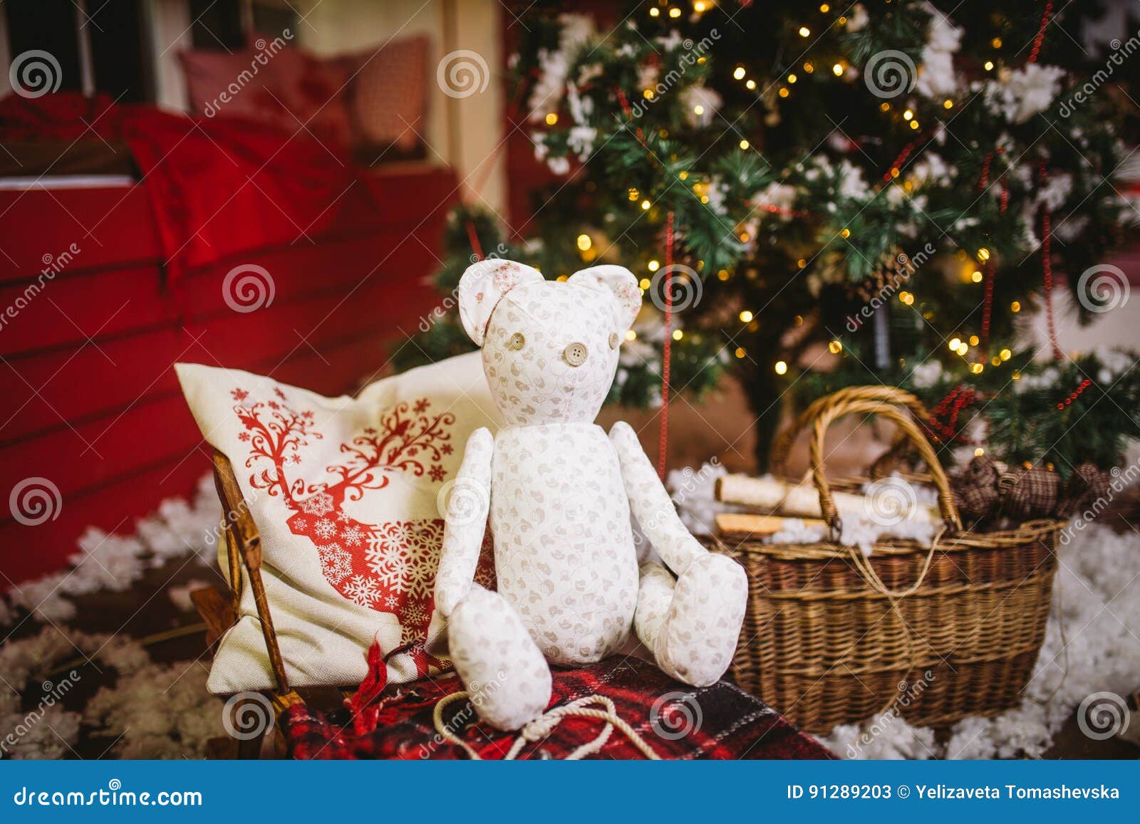 Teddy Bear Sitting Under Decorated with Lights Christmas Tree with Gift ...