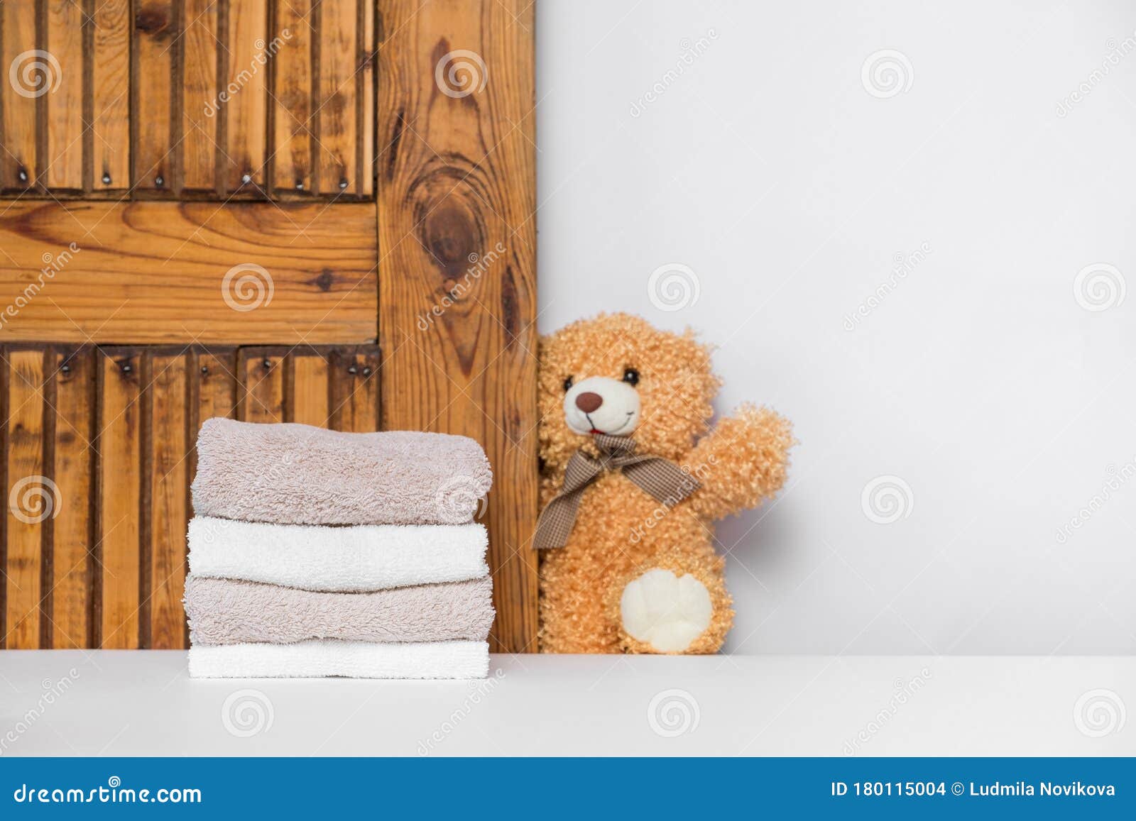 Teddy Bear and a Stack of Clean and Fresh Cotton Towels Stock Photo ...