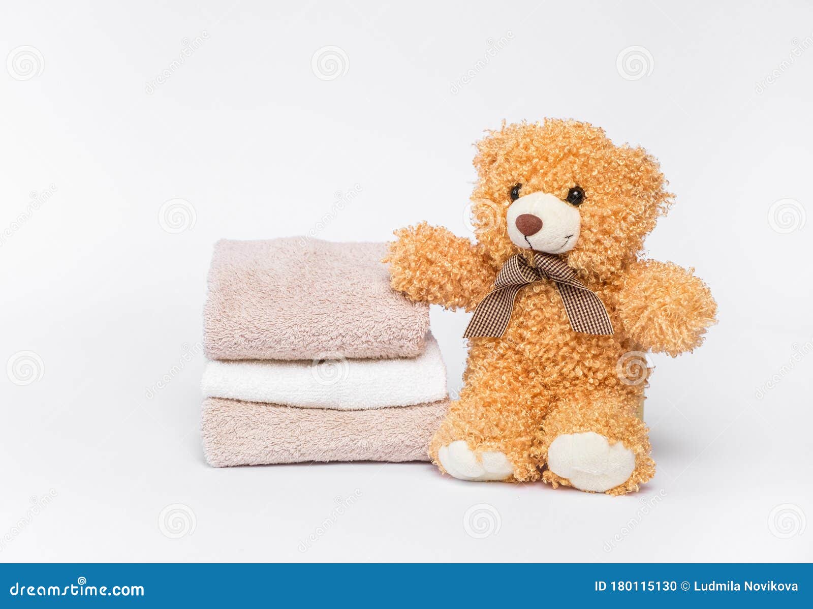 Teddy Bear and a Stack of Clean and Fresh Cotton Towels Stock Photo ...