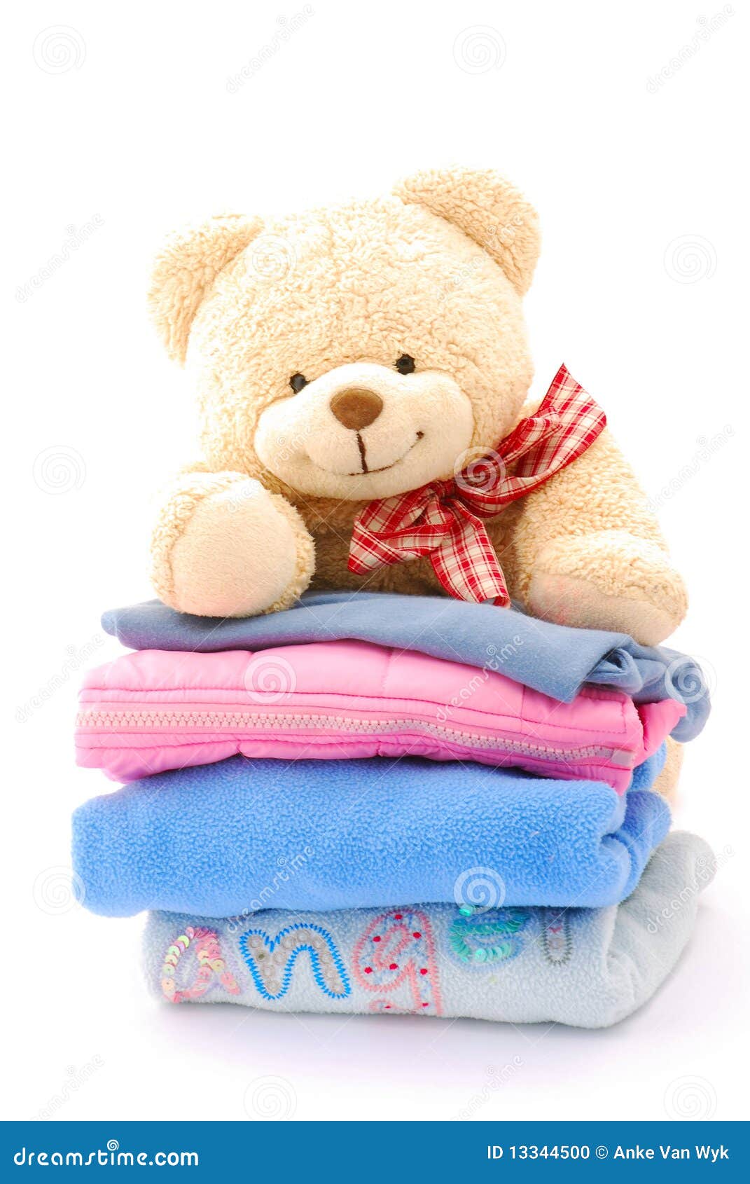 Teddy Bear Stack of Kids Clothes Stock Photo - Image of folded, pile ...