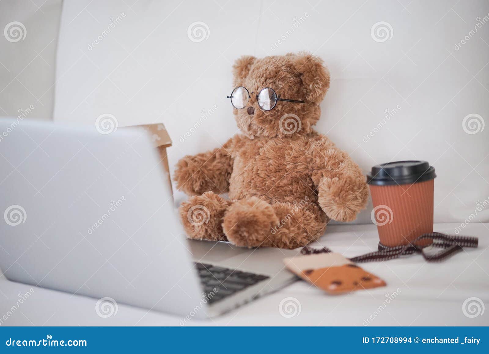 Teddy Bear Working Concept. a Cute Teddy Bear Working in Bed with a ...