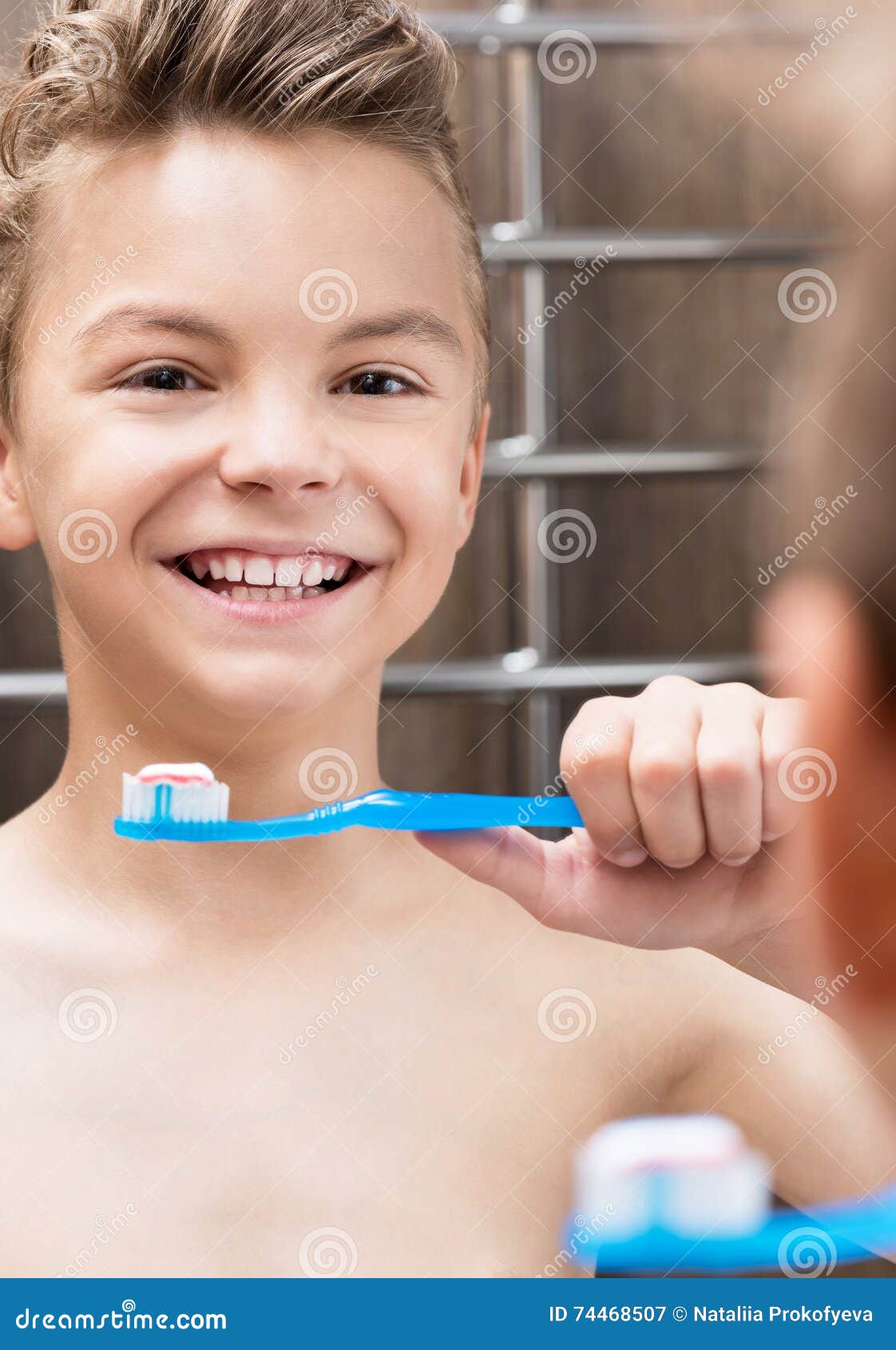 Teen boy brushing teeth stock image. Image of caucasian - 74468507