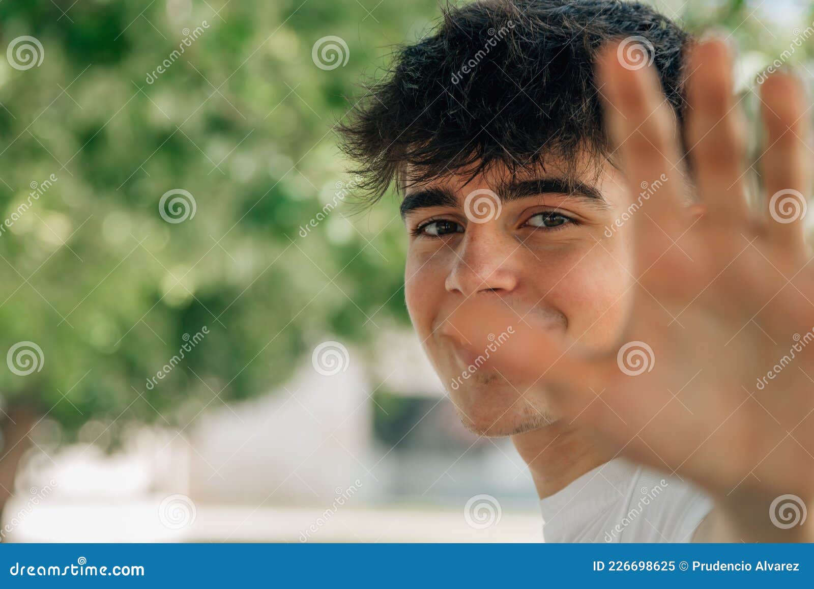 Teen Boy with Hand in Front of Camera Stock Image - Image of modern ...